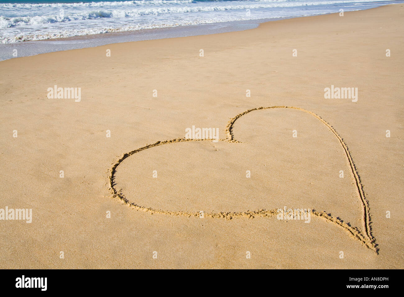 heart drawn in the smooth beach sand Stock Photo - Alamy