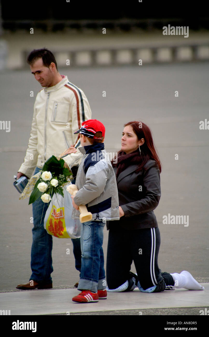 FATIMA PORTUGAL Woman religious pilgrim walks on her knees in penance ...