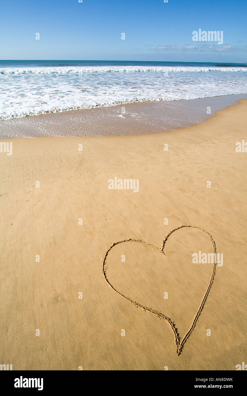 heart drawn in the smooth beach sand Stock Photo - Alamy