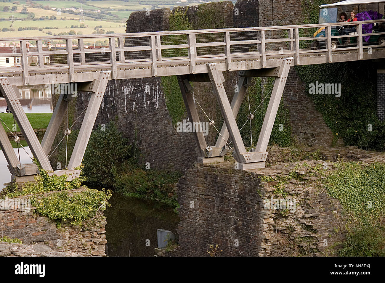 Caerphilly Castle modern bridge across dry moat Stock Photo - Alamy