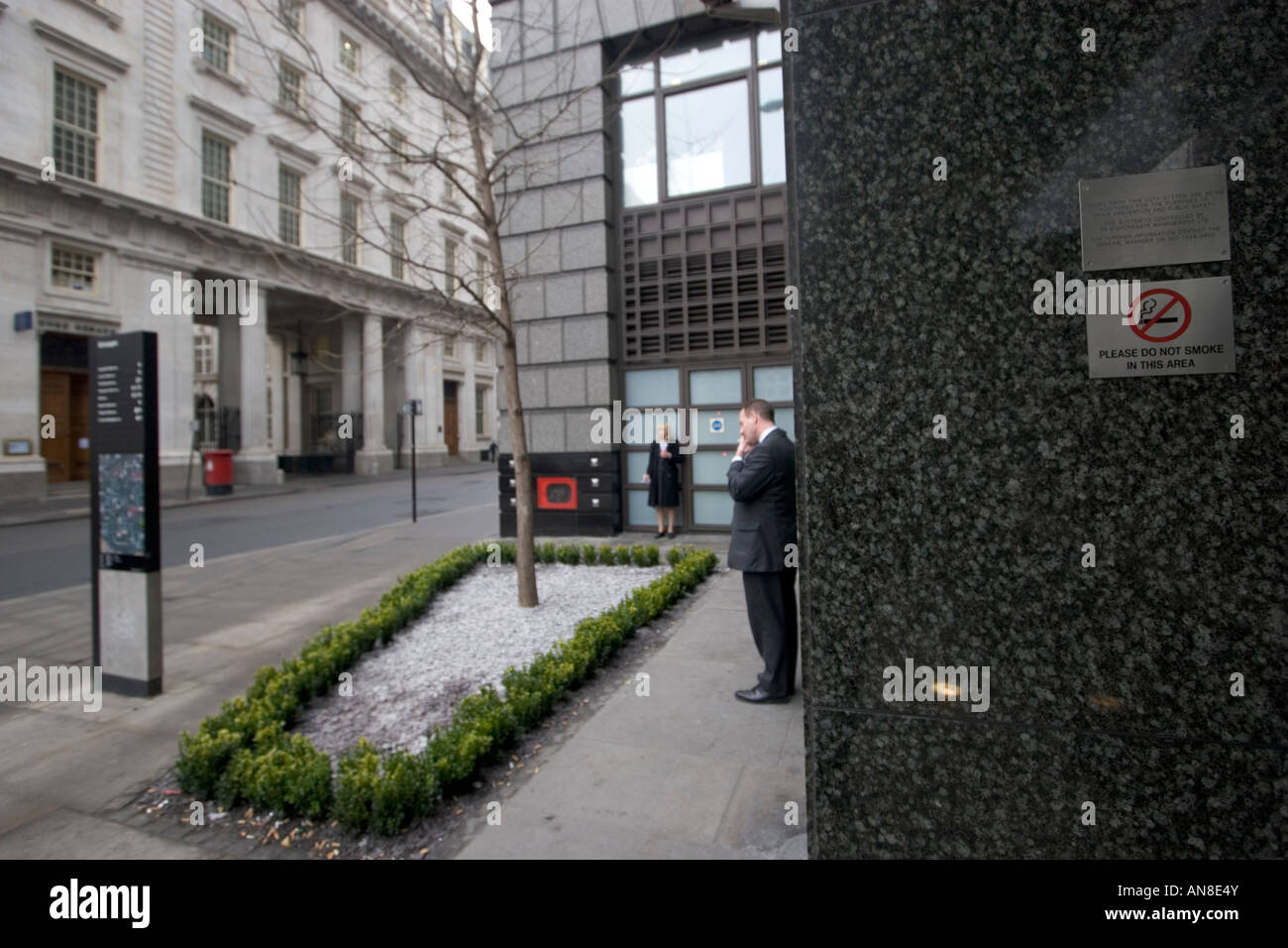 smokers with no smoking sign in central london after introduction of ...