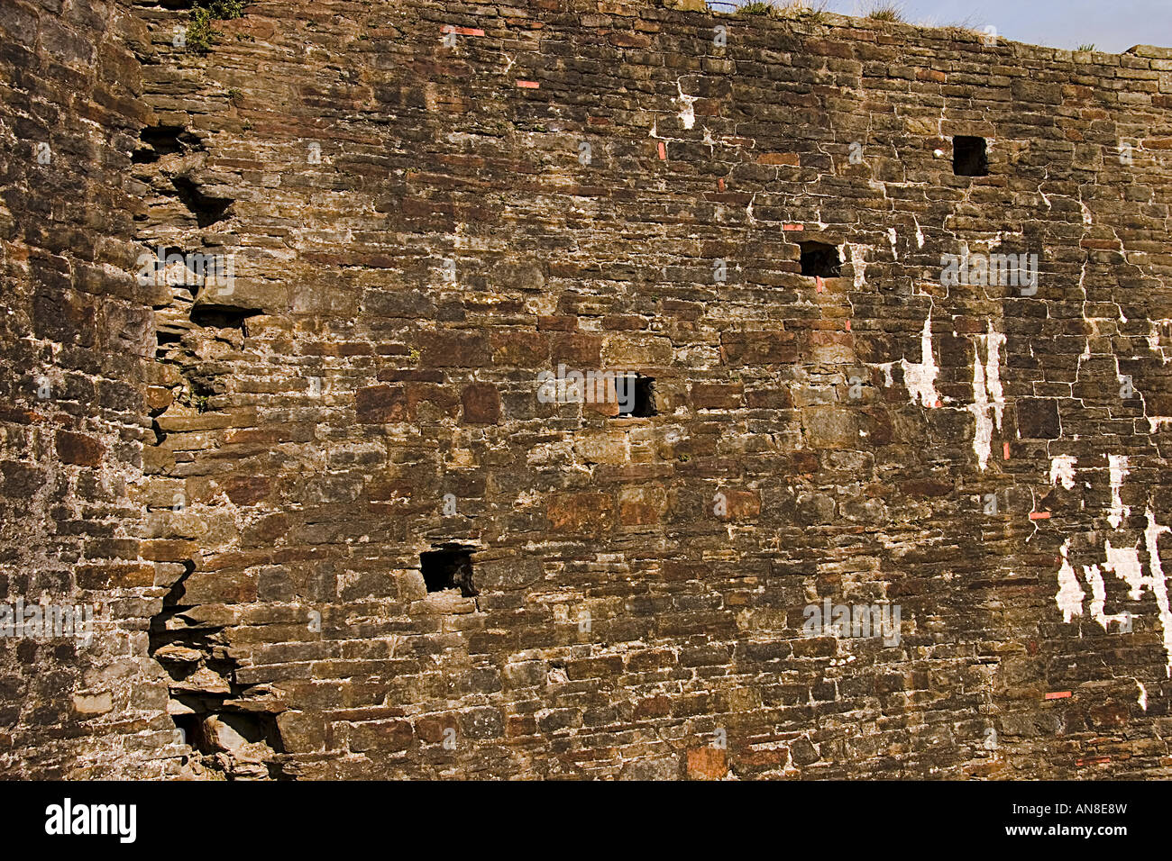 Caerphilly Castle wall showing original holes for stair timbers, floor ...