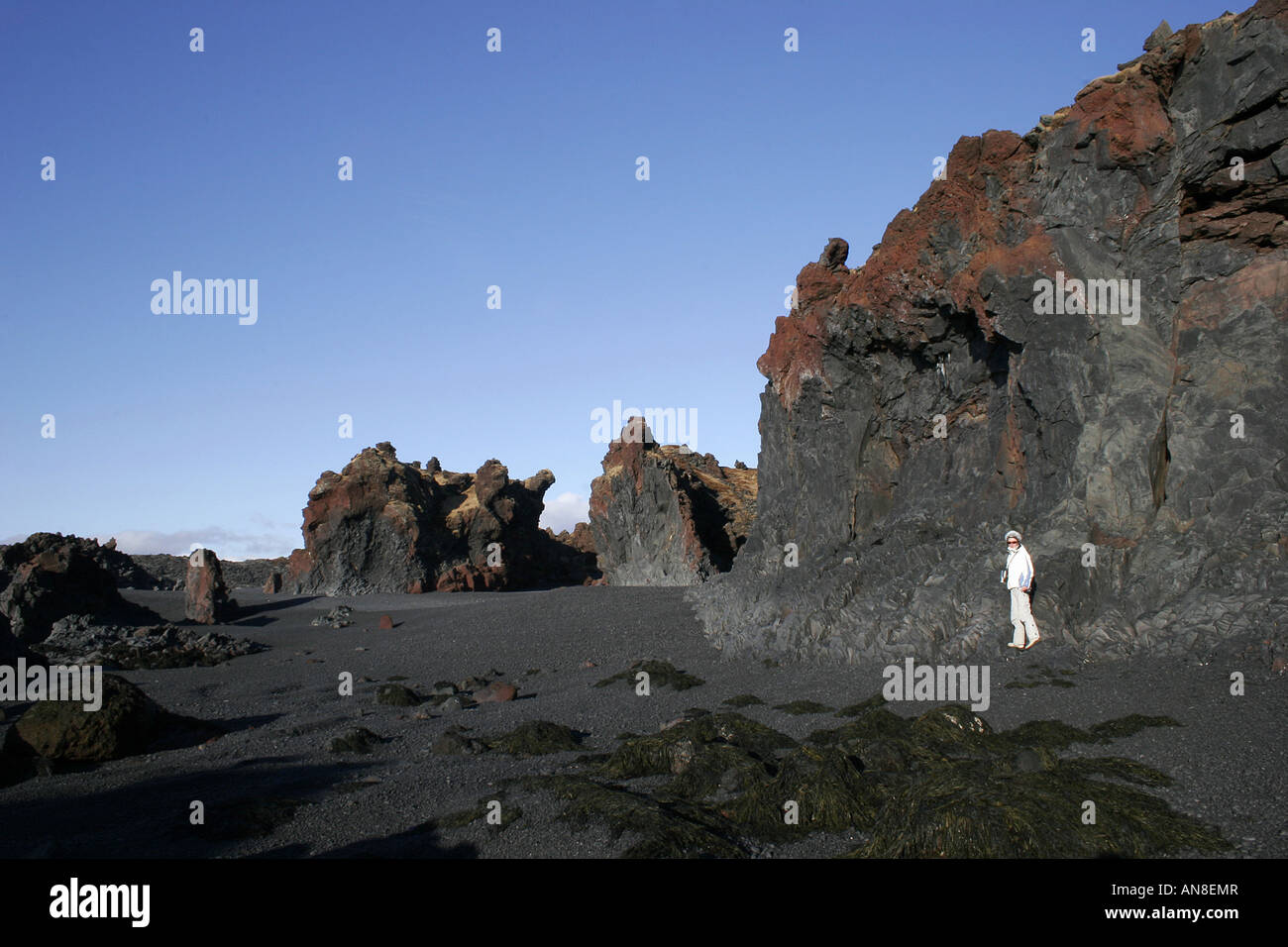 volcanic beach in Iceland with figure Stock Photo - Alamy
