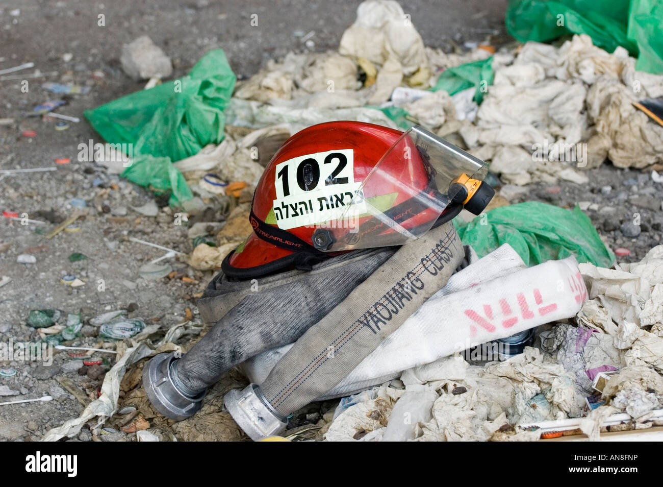 Israel Fire fighters equipment helmet and rolled up hose Stock Photo ...