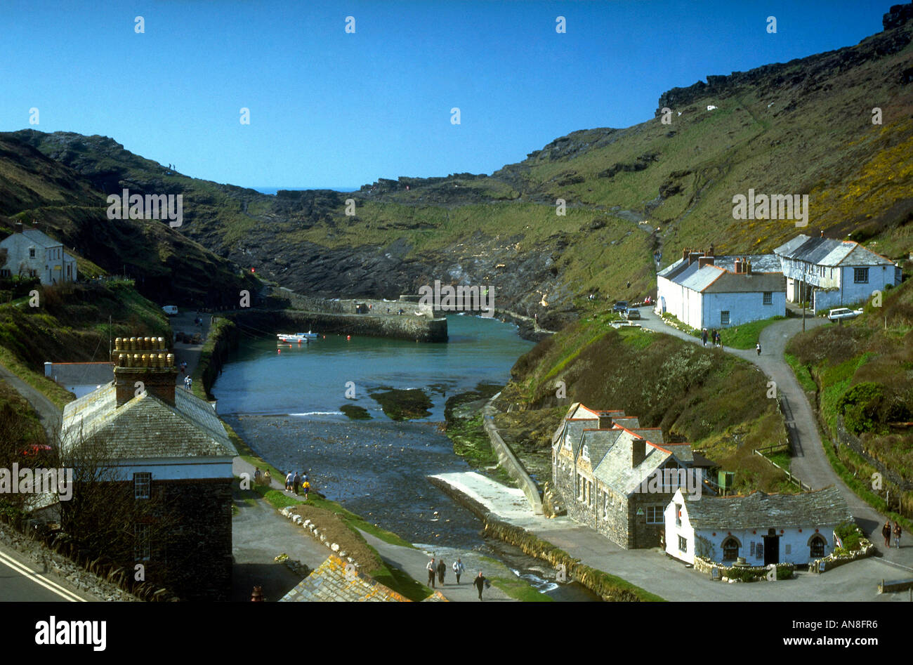 The quiet cliff sheltered harbour surrounded by houses at Boscastle ...