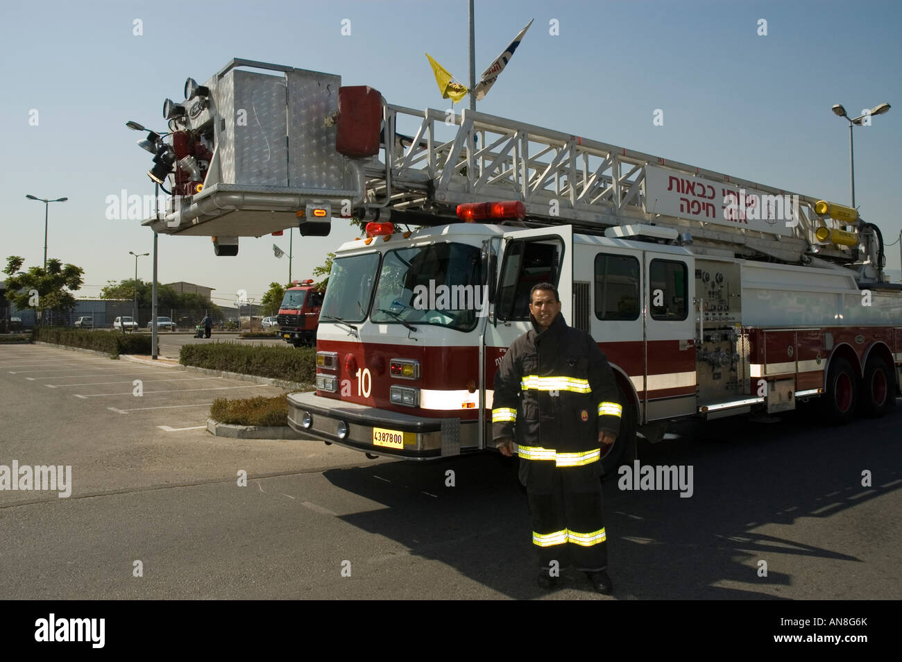 Israel Fire fighter standing next to his truck Stock Photo - Alamy