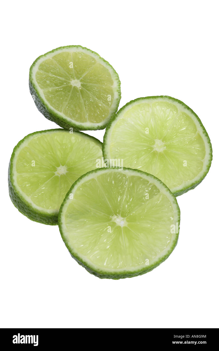 Lime slices cut out on white background Stock Photo - Alamy