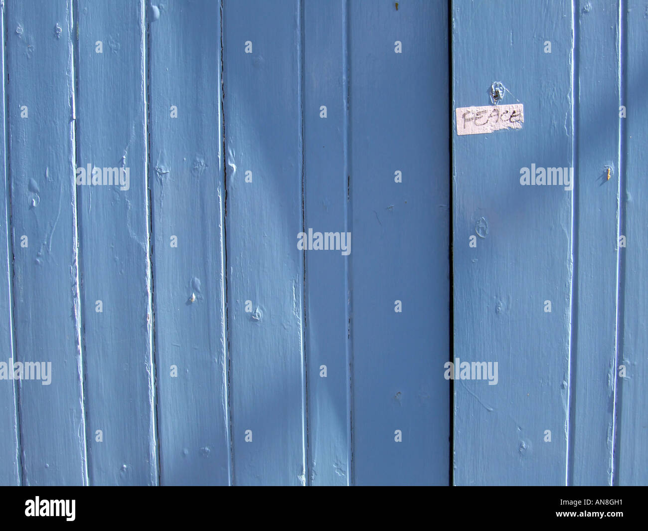 Peace sign sticker on building door Stock Photo - Alamy