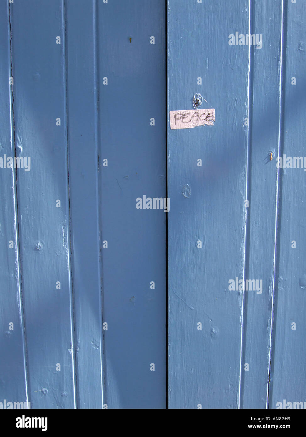 Peace sign sticker on building door Stock Photo - Alamy