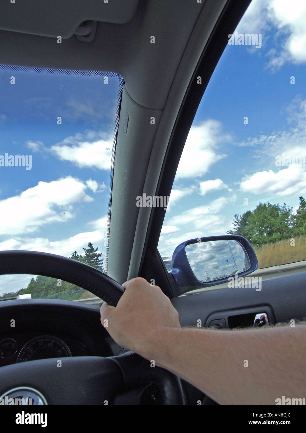 Interior view from a car, steering wheel and drivers arms Stock Photo ...
