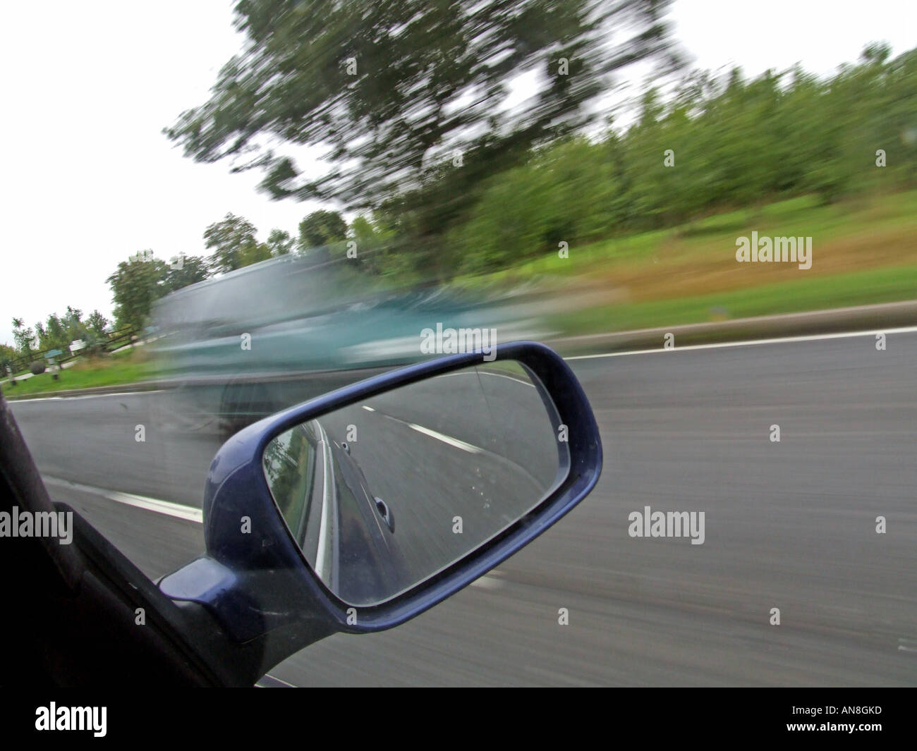 View from the window of a speeding car Stock Photo - Alamy