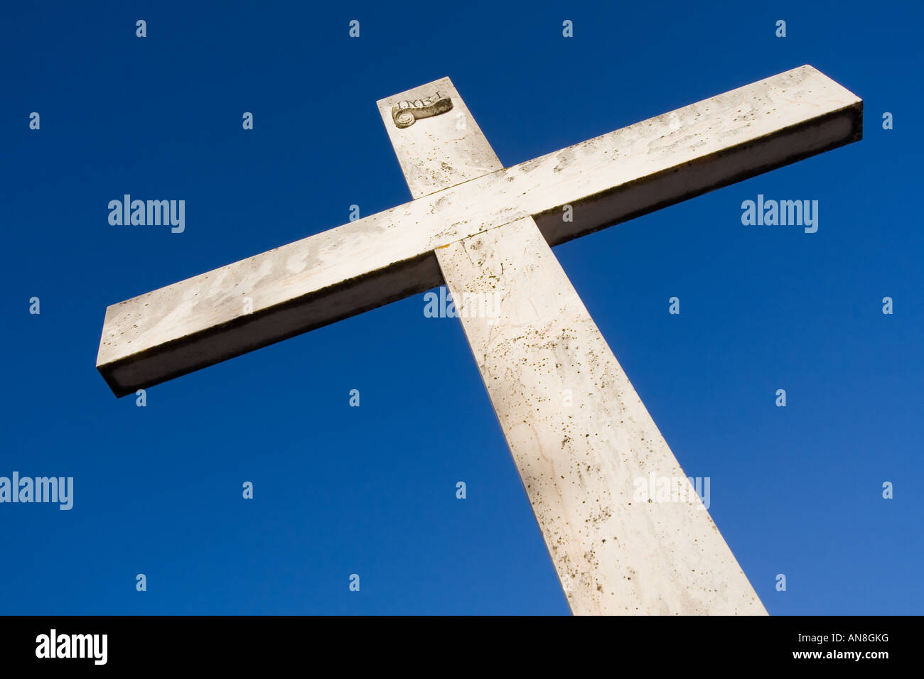 large stone cross against clear blue sky Stock Photo - Alamy