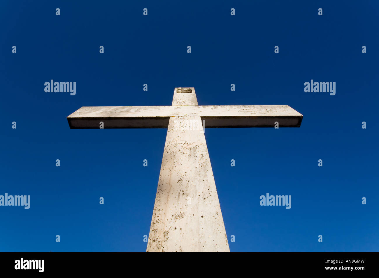 large stone cross against clear blue sky Stock Photo - Alamy