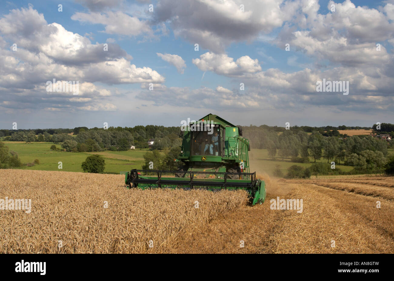 John Deere combine working in Norfolk wheat field Stock Photo - Alamy