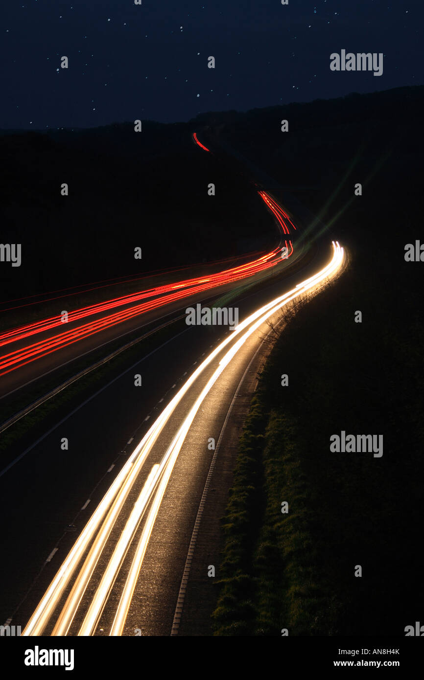 Light trails on the A30 from Devon into Cornwall at dusk in Devon ...