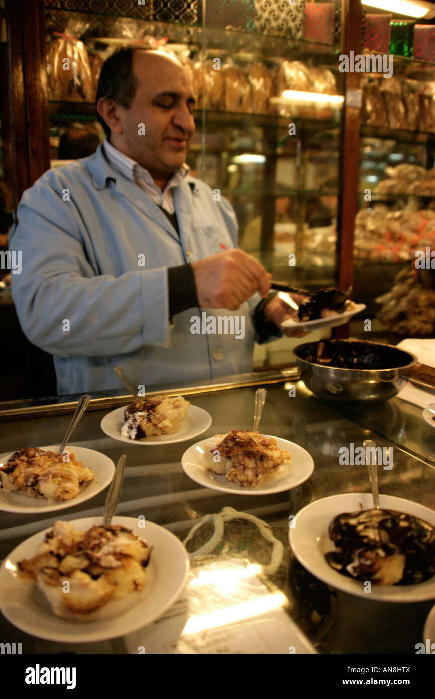 Serving up profiteroles at heritage Inci patisserie, Beyoglu, Istanbul ...