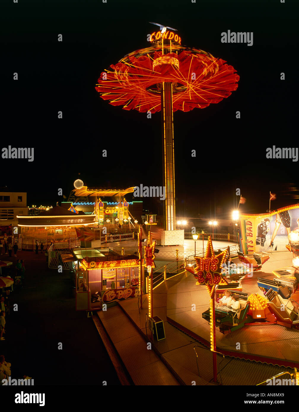 Fun fair rides at Great Yarmouth Pleasure Beach lit with neon lights at ...