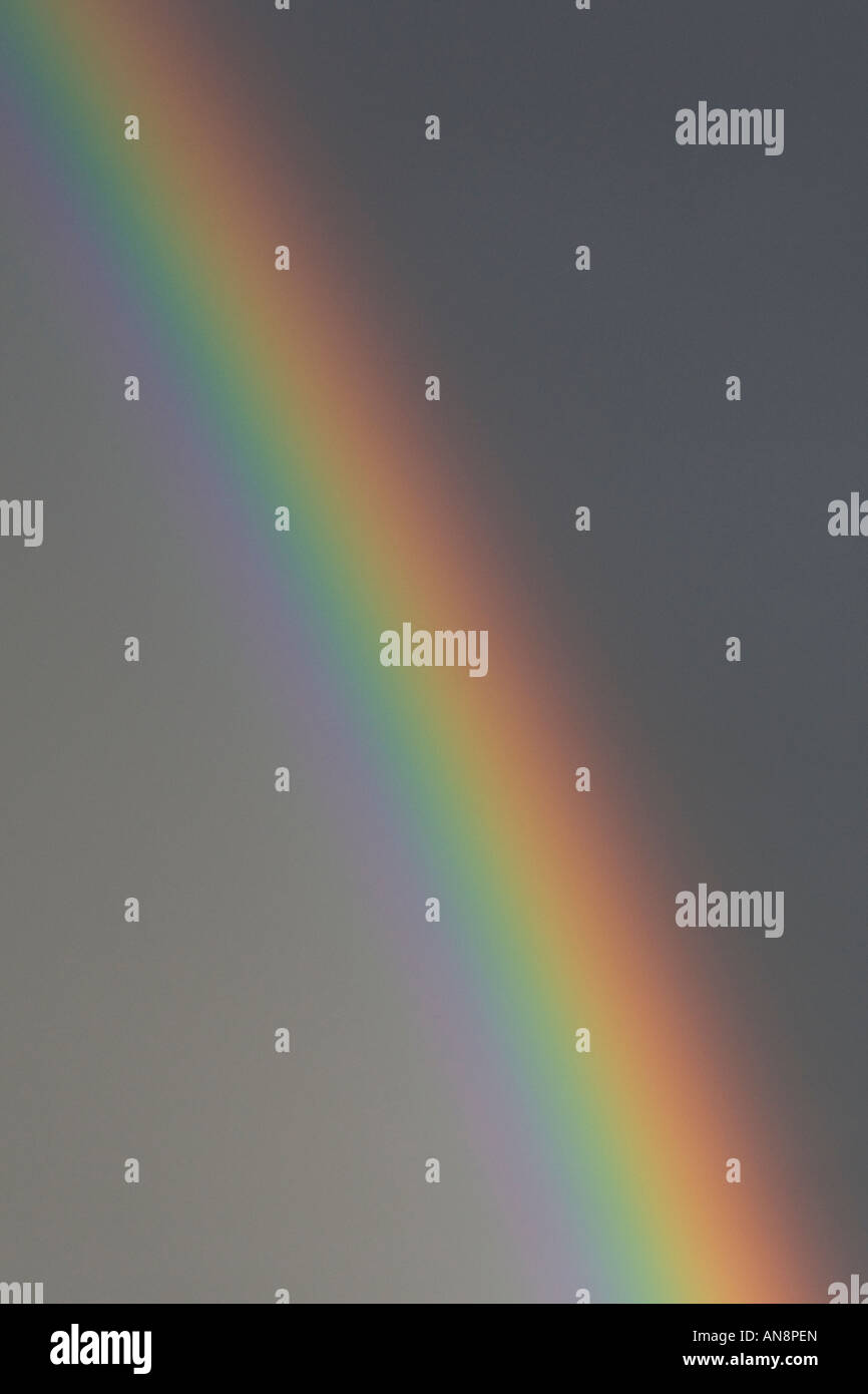 Rainbow in a grey sky Stock Photo - Alamy