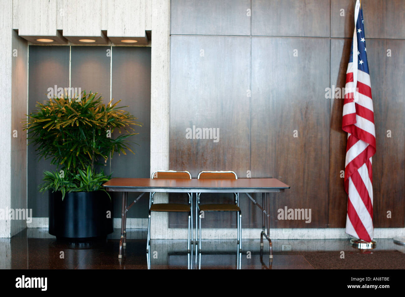 flag and table in lobby Stock Photo - Alamy