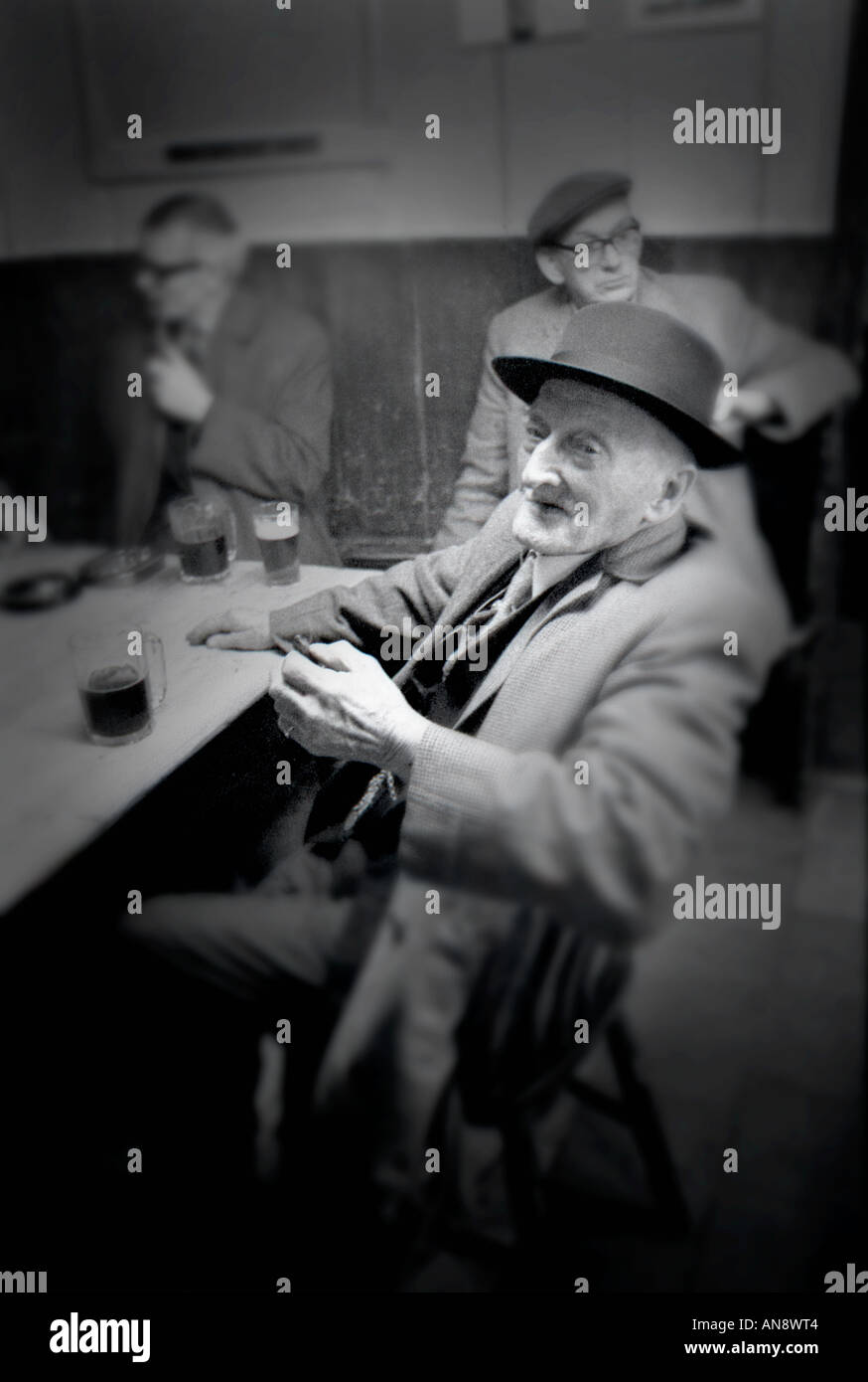 old man sitting in traditional pub Stock Photo - Alamy