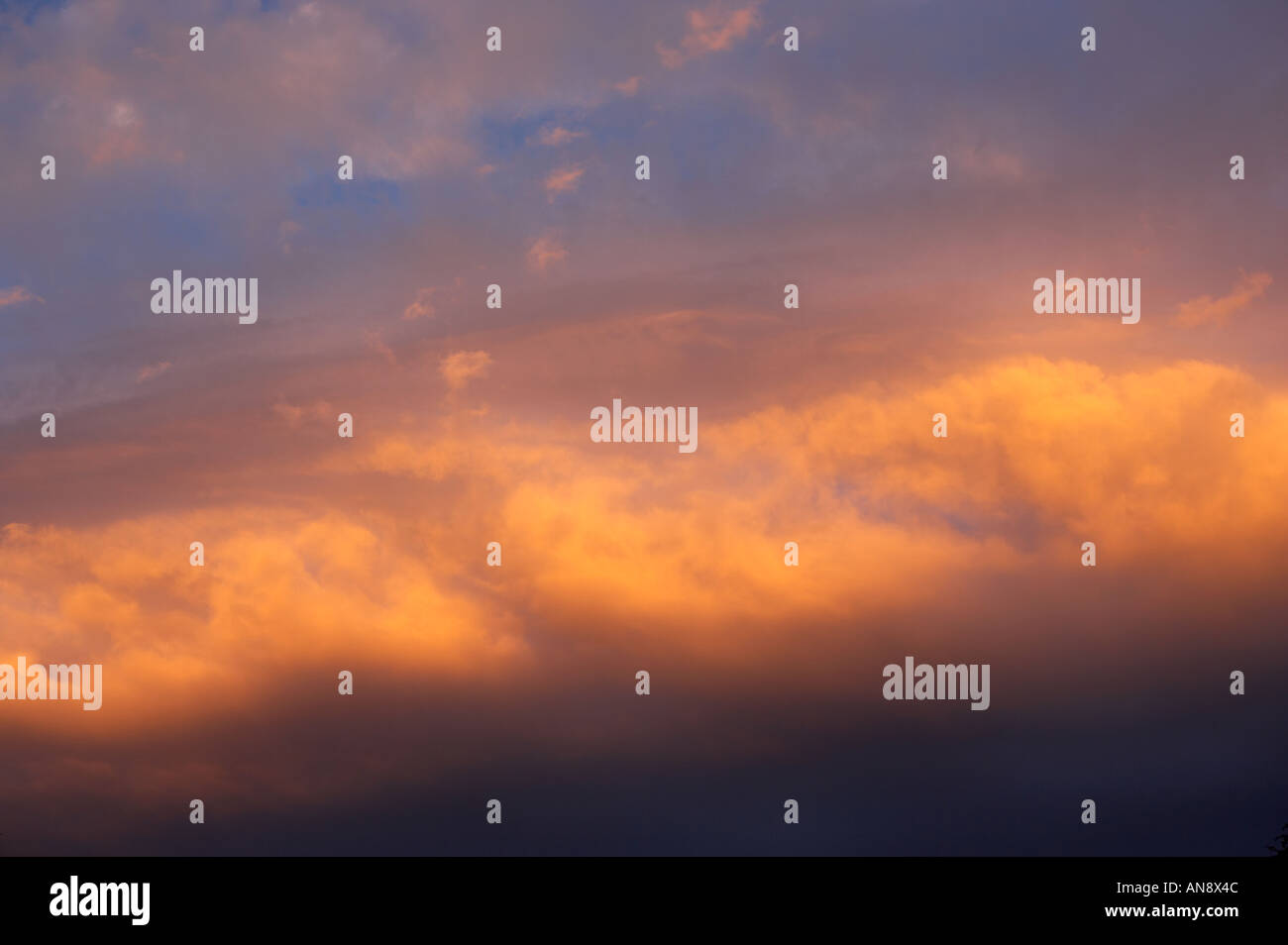 GOLD SUNLIGHT ON CLOUDS AT TWILIGHT Stock Photo - Alamy
