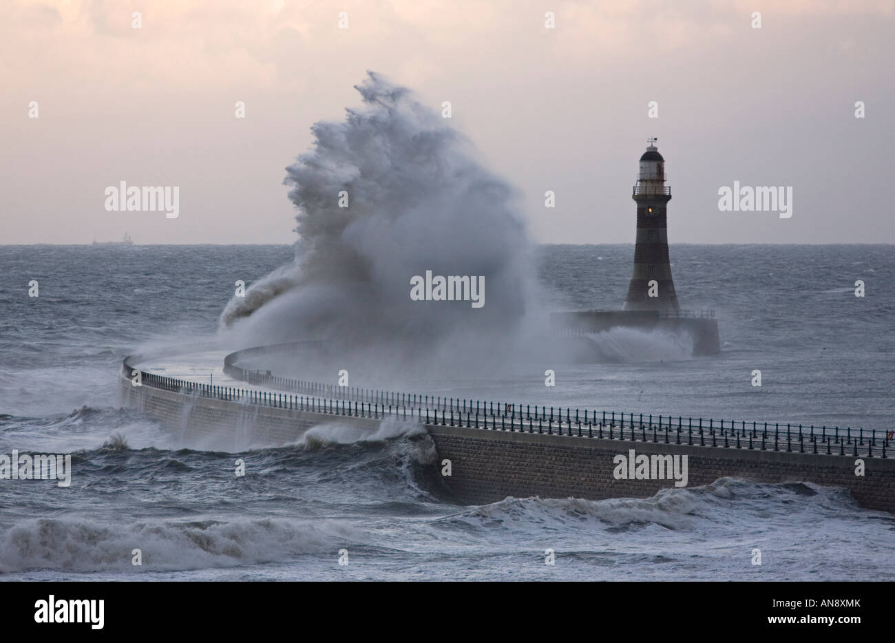 Huge ocean waves break over the Lighthouse on Roker Pier, during a ...
