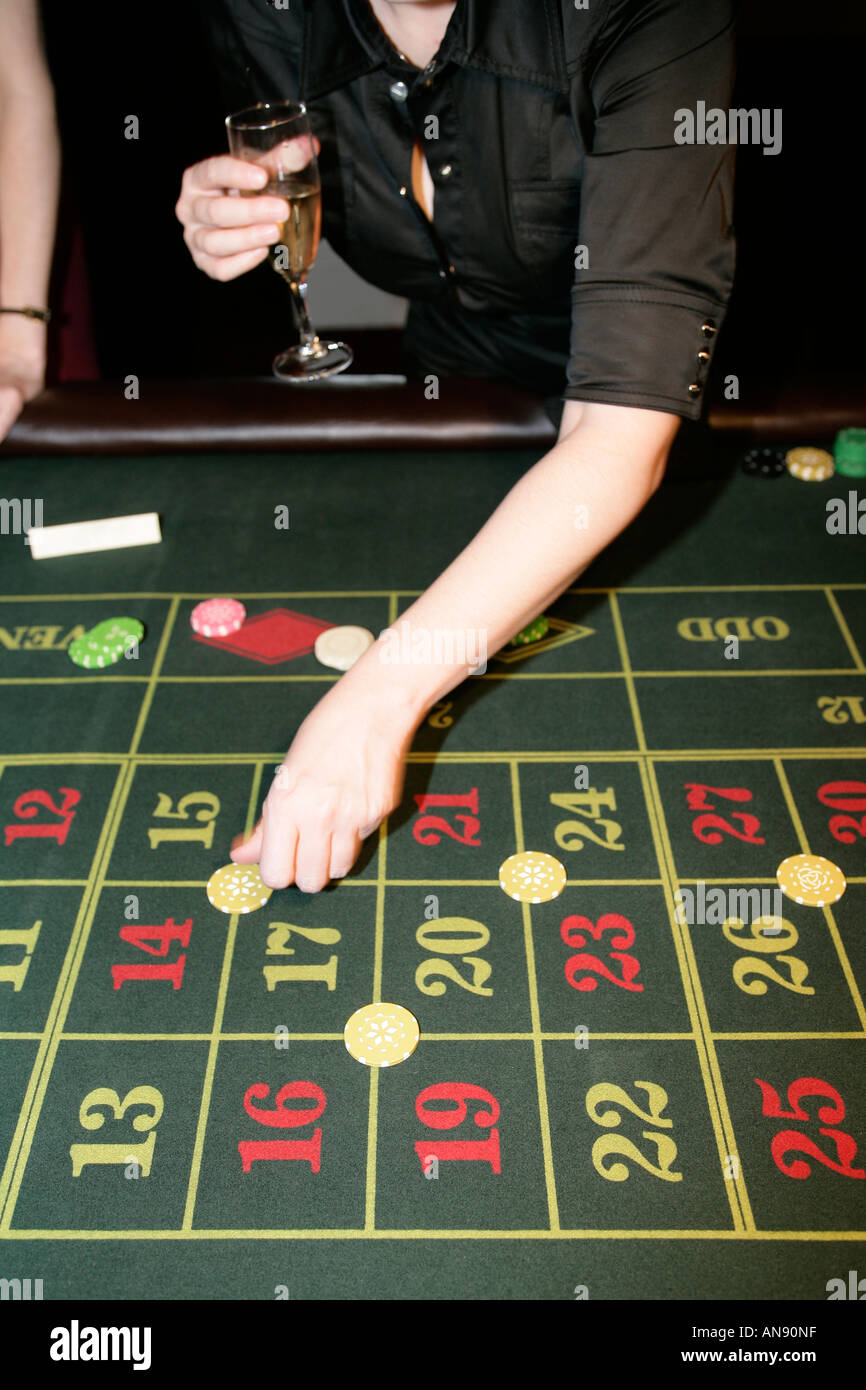 Placing bet on roulette table hi-res stock photography and images - Alamy