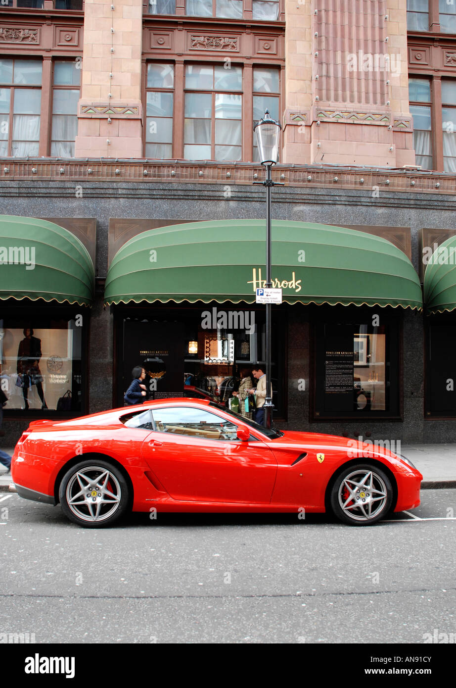 Red high performance car parked outside Harrods in London Stock Photo ...