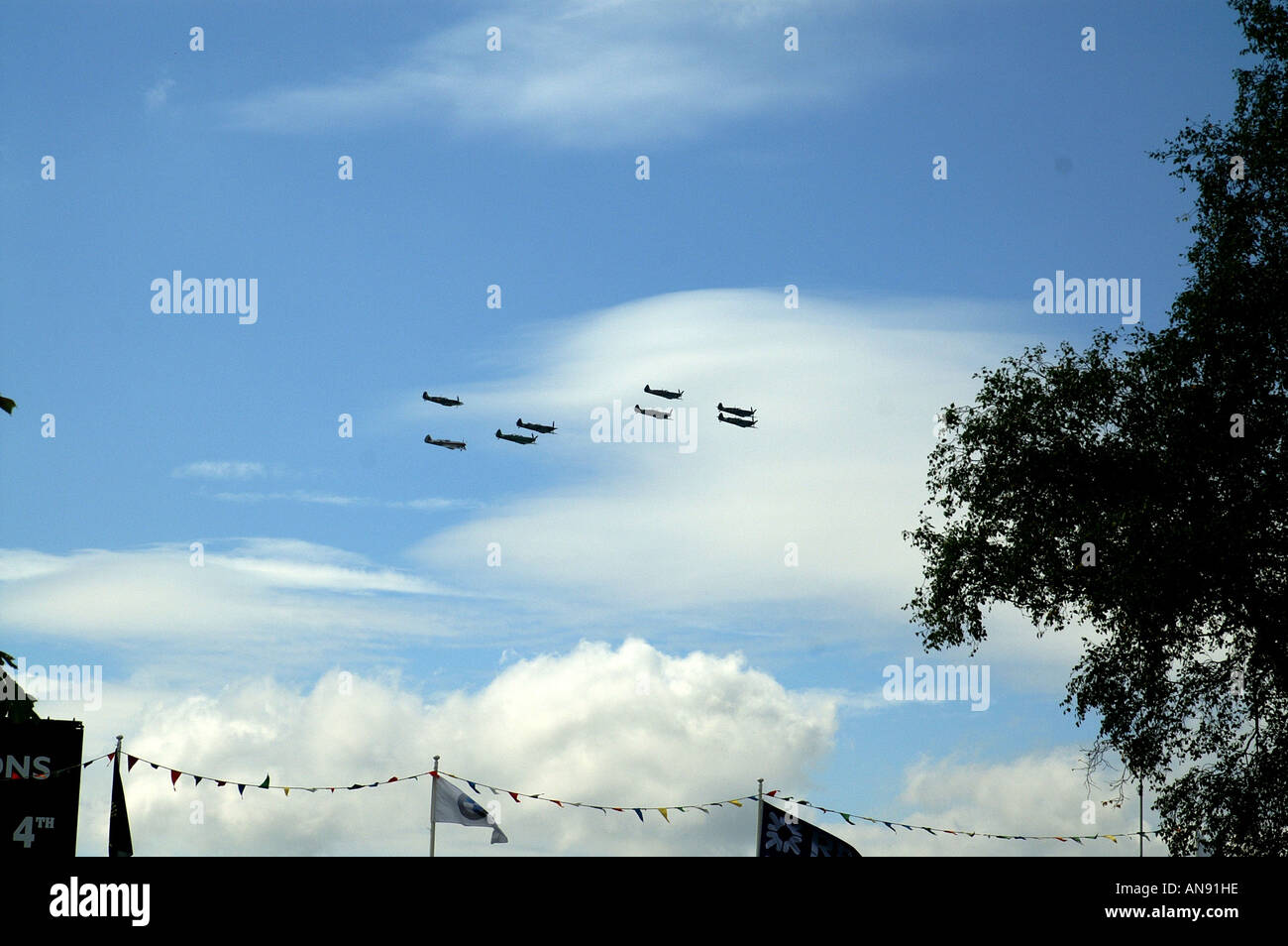8 Spitfires flying in formation over Goodwood Stock Photo - Alamy