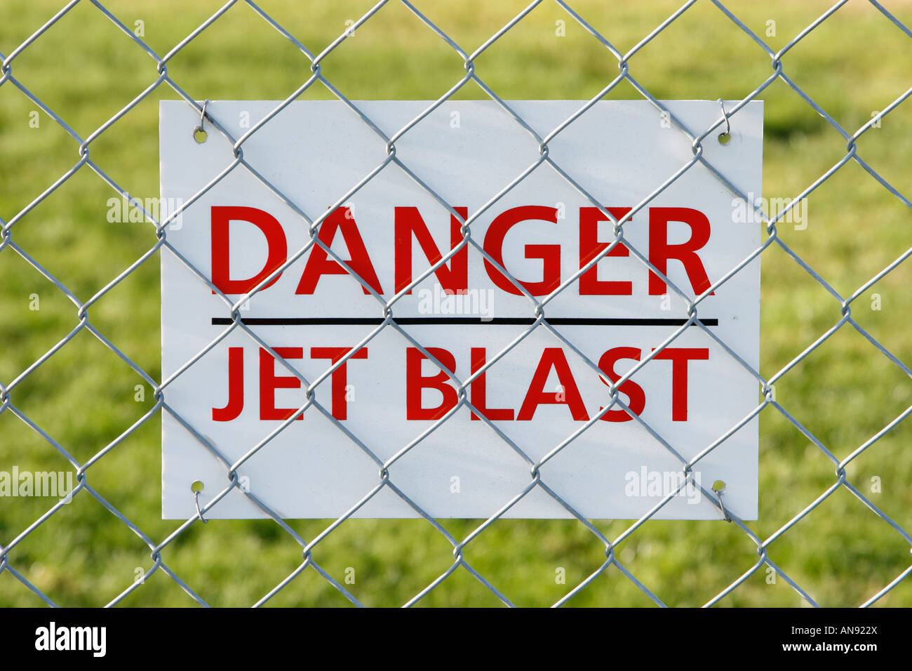 Sign at airport warning of jet blast from aircraft Stock Photo - Alamy