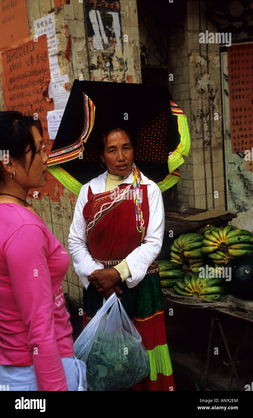 A yi woman wears her traditional dress in a local market in Yunnan ...