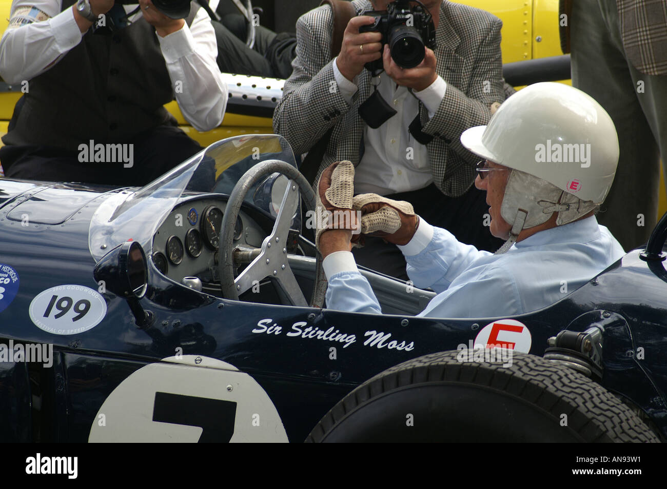 Sir Stirling Moss in racing car at Goodwood Stock Photo - Alamy