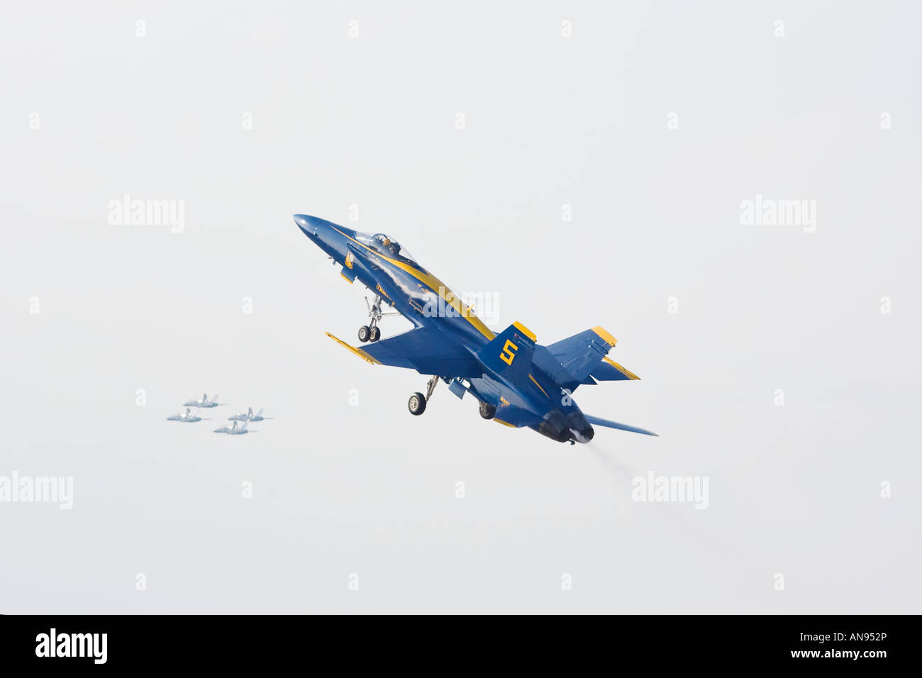 Blue Angels solo pass with diamond formation in background Stock Photo ...