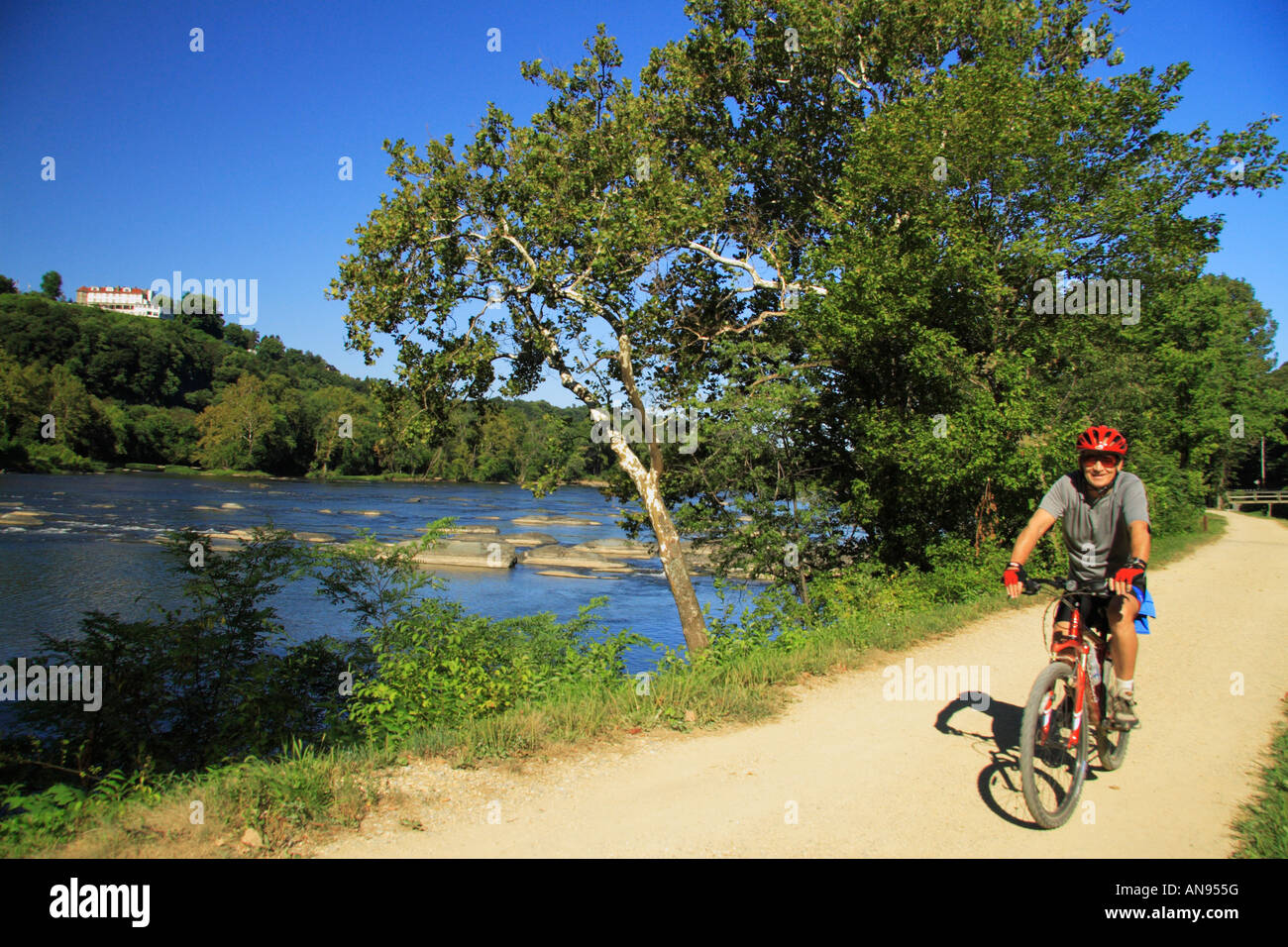 Biker on Tow Path, C and O Canal National Historic Park, Sandy Hook, Maryland, USA Stock Photo ...
