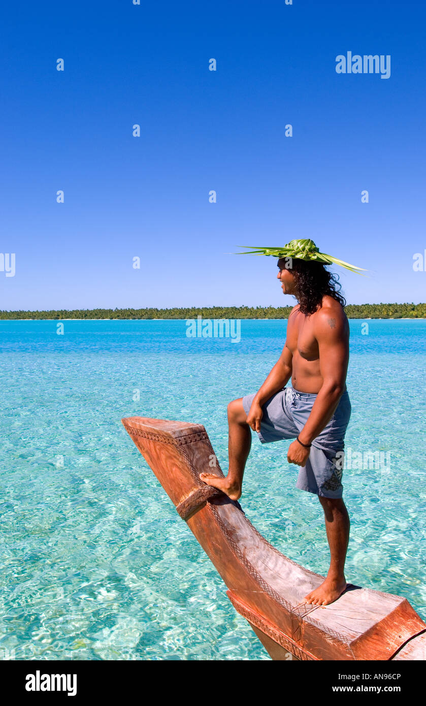 Aitutaki atoll Cook Islands male on prow of native canoe Stock Photo ...