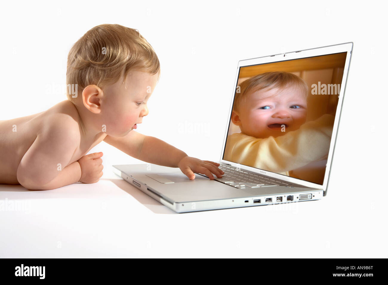 BABY PLAYING WITH LAPTOP COMPUTER Stock Photo - Alamy