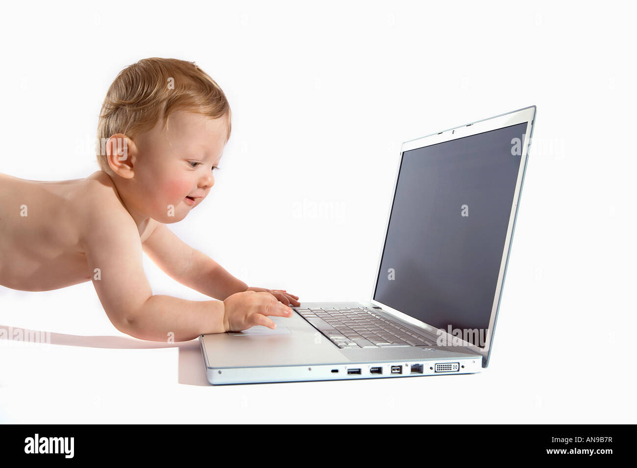 BABY PLAYING WITH LAPTOP COMPUTER Stock Photo - Alamy