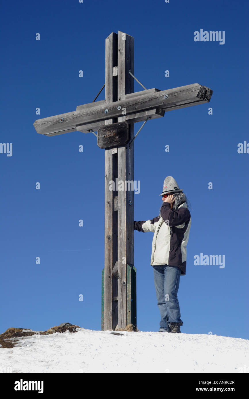 Mountain top mobile telephone conversation by the cross at one of the ...