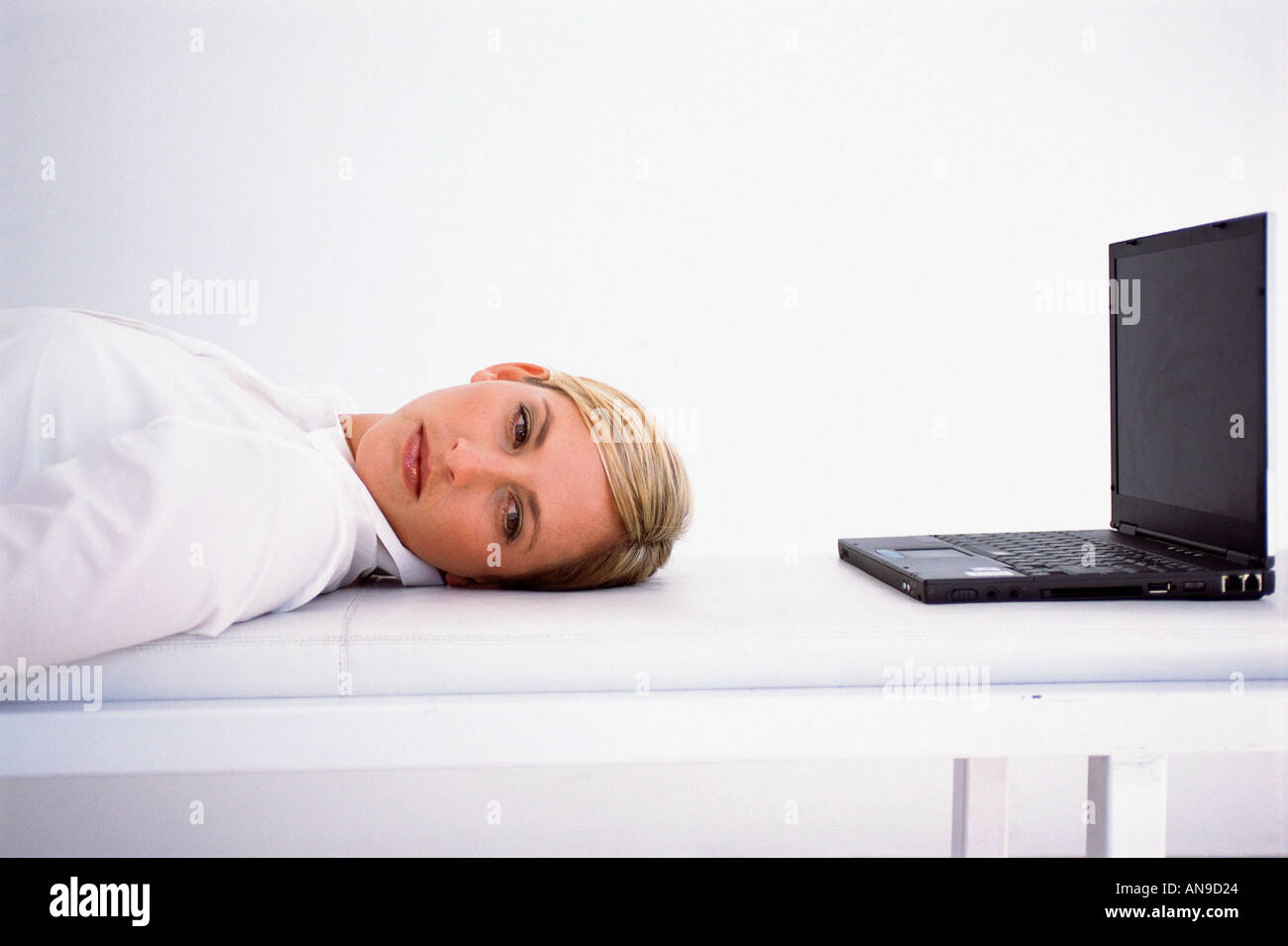 Female and laptop on bench Stock Photo - Alamy