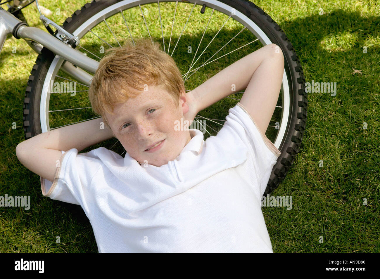 Young boy with bicycle Stock Photo - Alamy