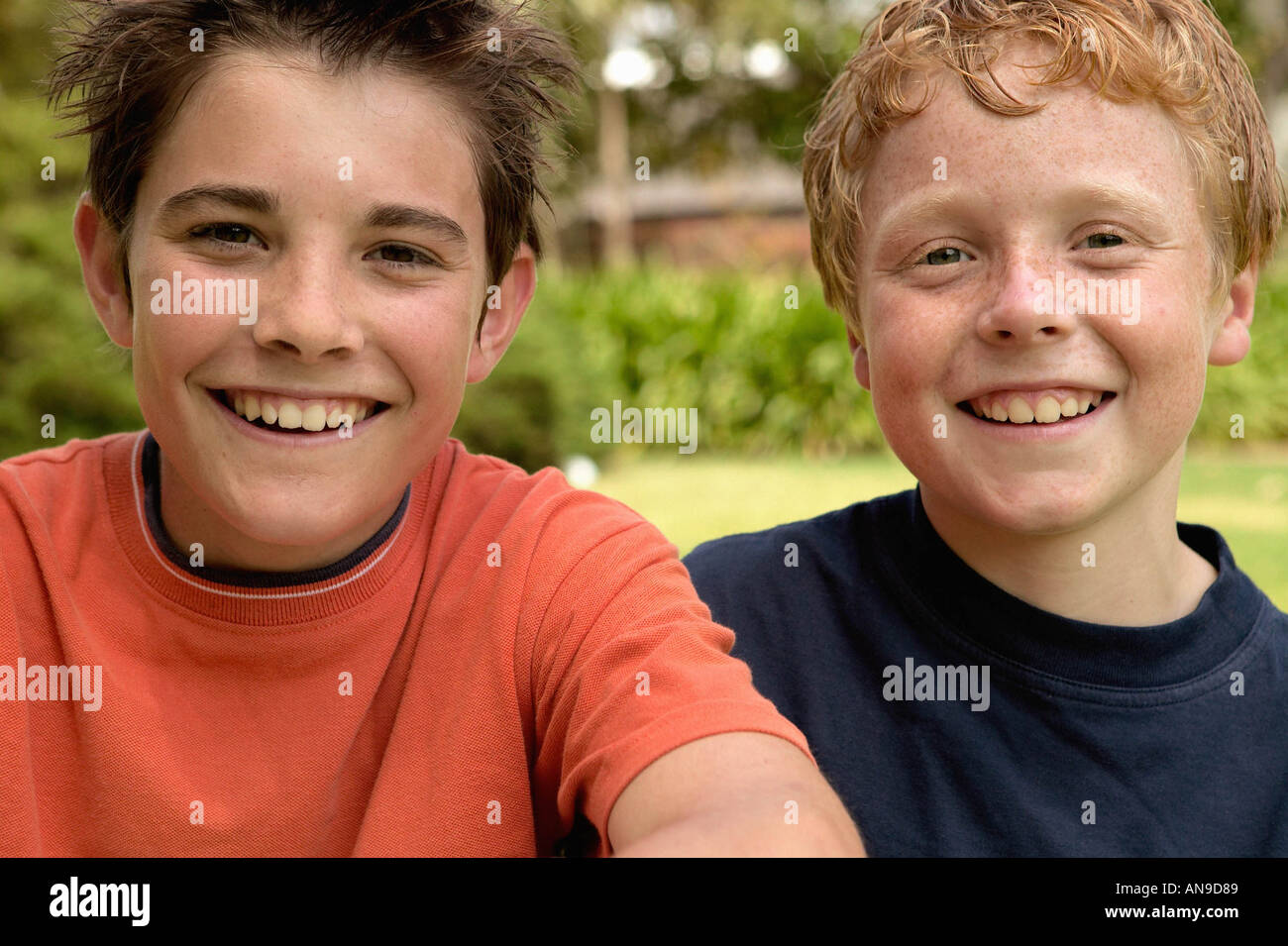 Young boys smiling at camera Stock Photo - Alamy