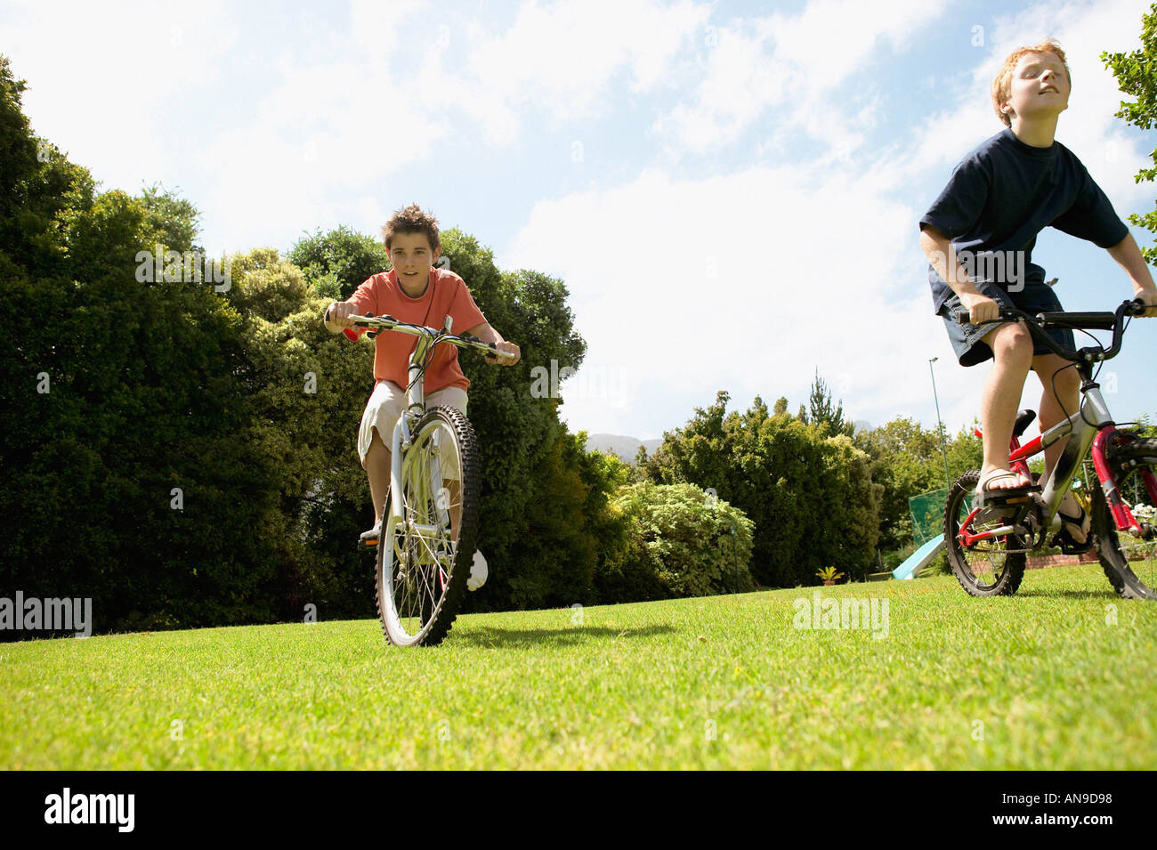 Teenager boys cycling hi-res stock photography and images - Alamy