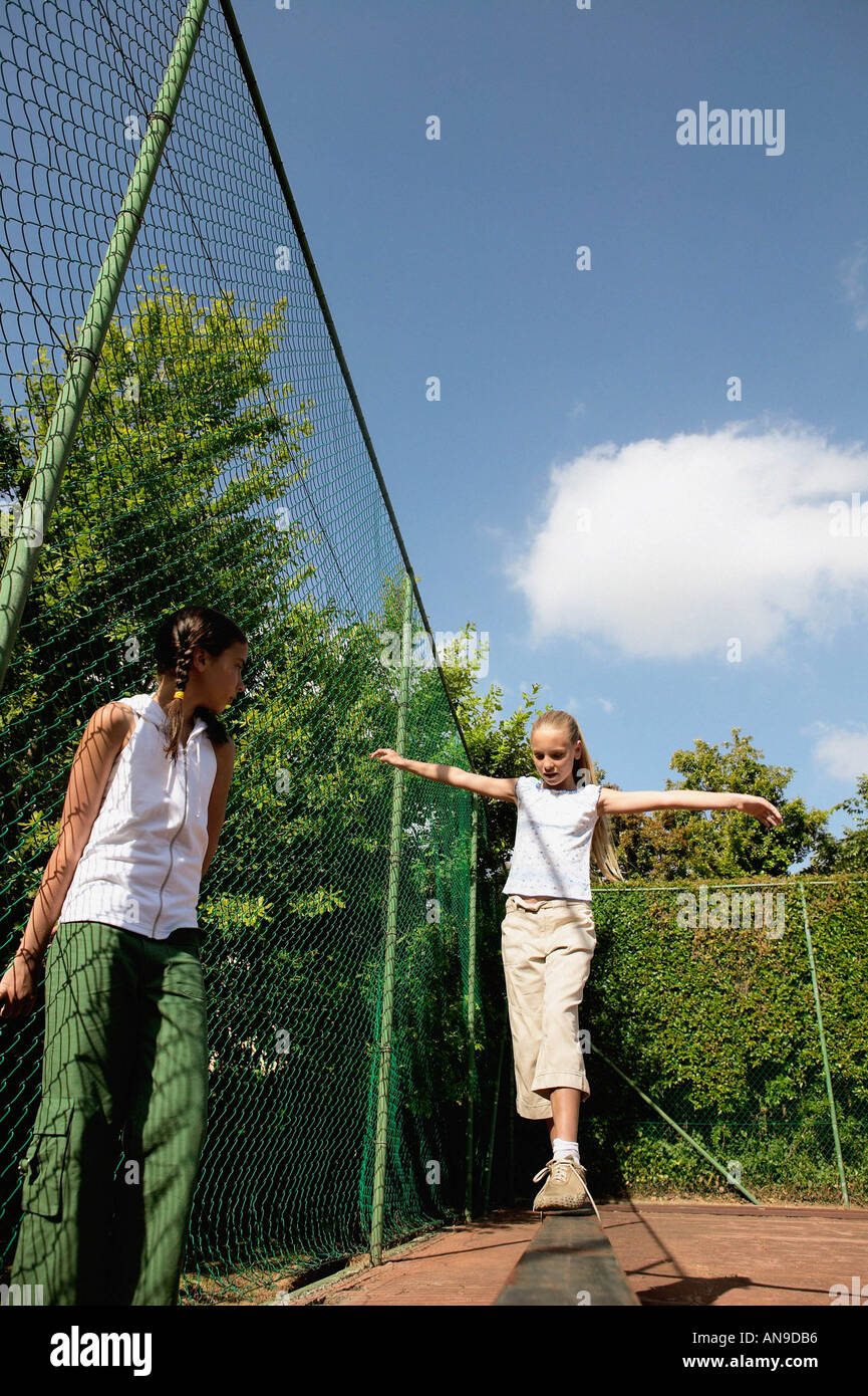 Girls playing outdoors Stock Photo - Alamy