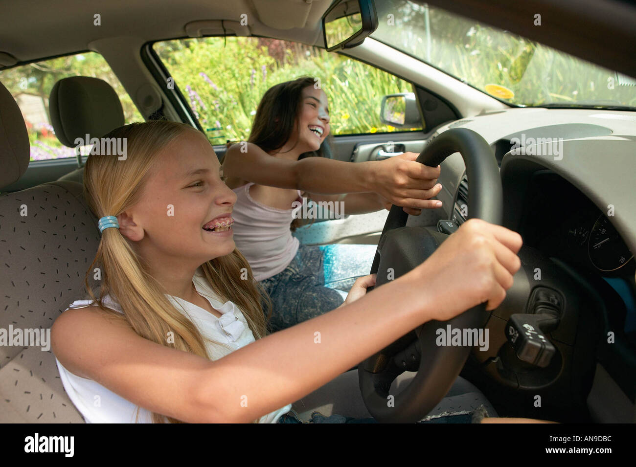 Girls having fun in car Stock Photo - Alamy