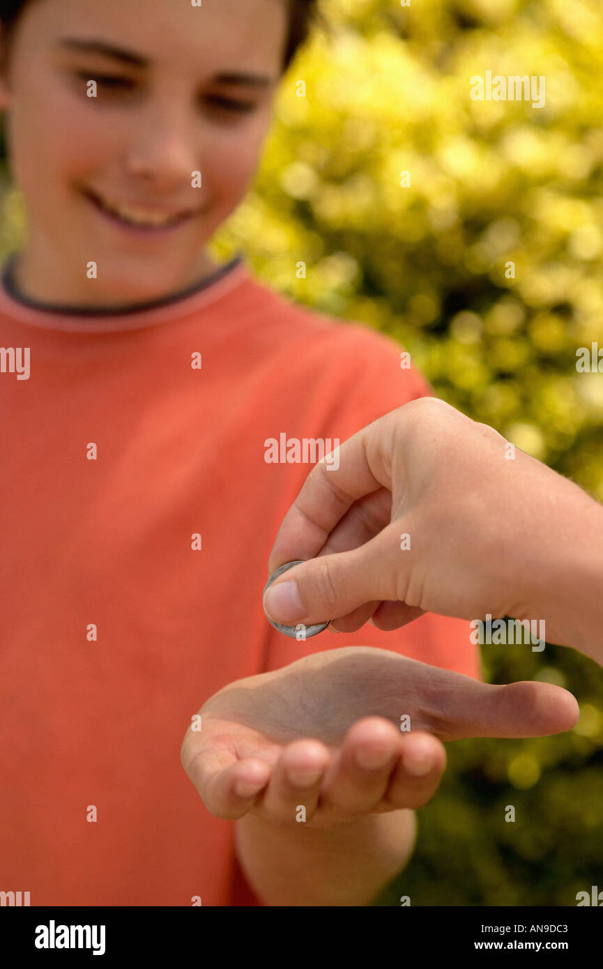 Boy with pocket money in hand hi-res stock photography and images - Alamy