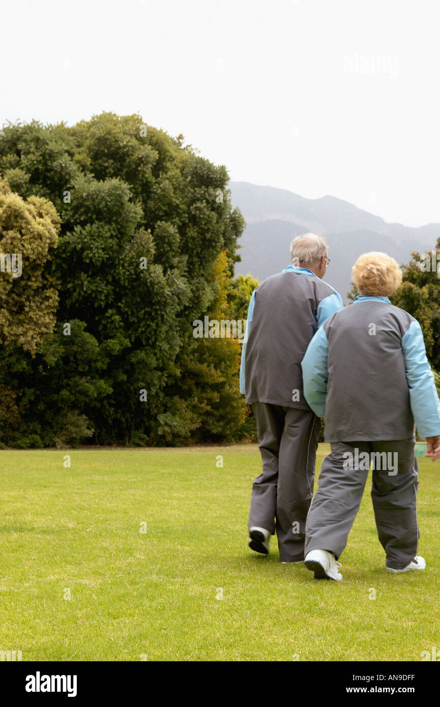 Older couple walking away hi-res stock photography and images - Alamy