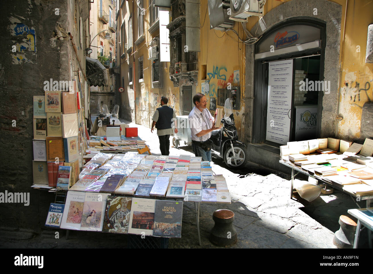 A book seller in the old quarter of Naples Italy Stock Photo - Alamy