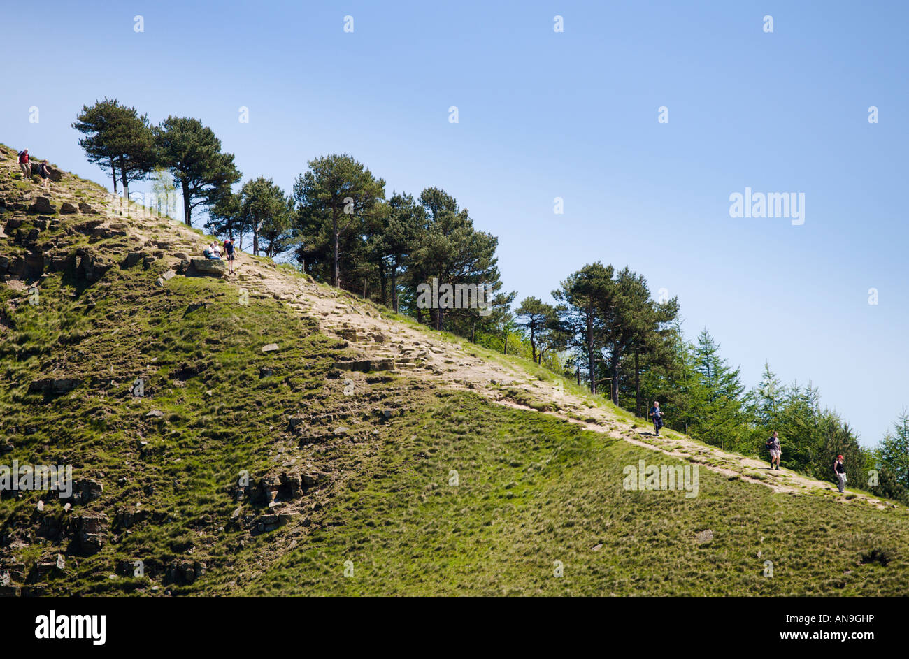 Walkers Climbing On The Summit Of Back Tor Ridge Walking Down A ...