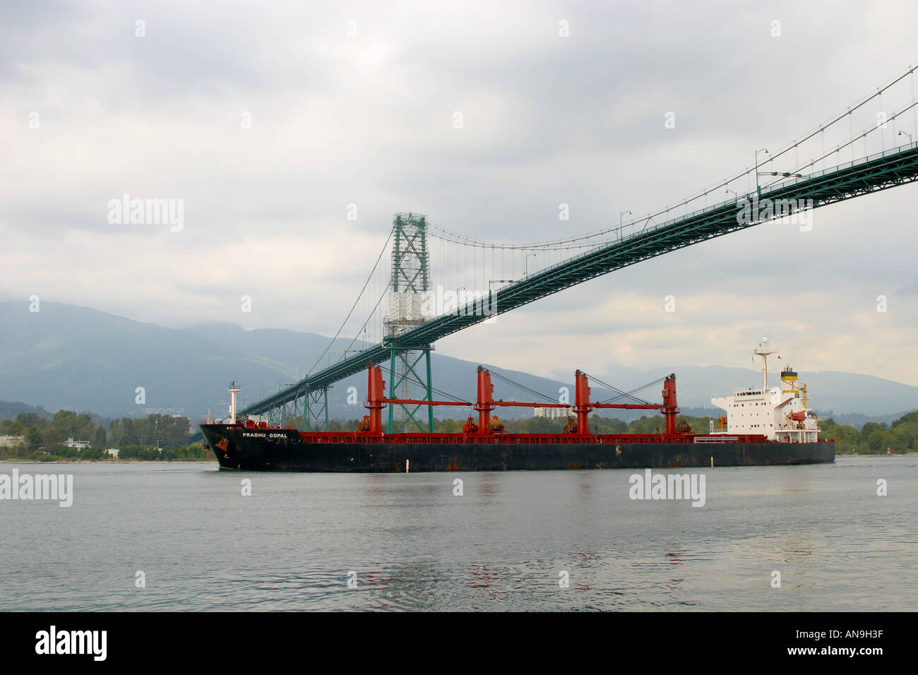 Large ship passing under a bridge, Vancouver British Columbai Canada ...