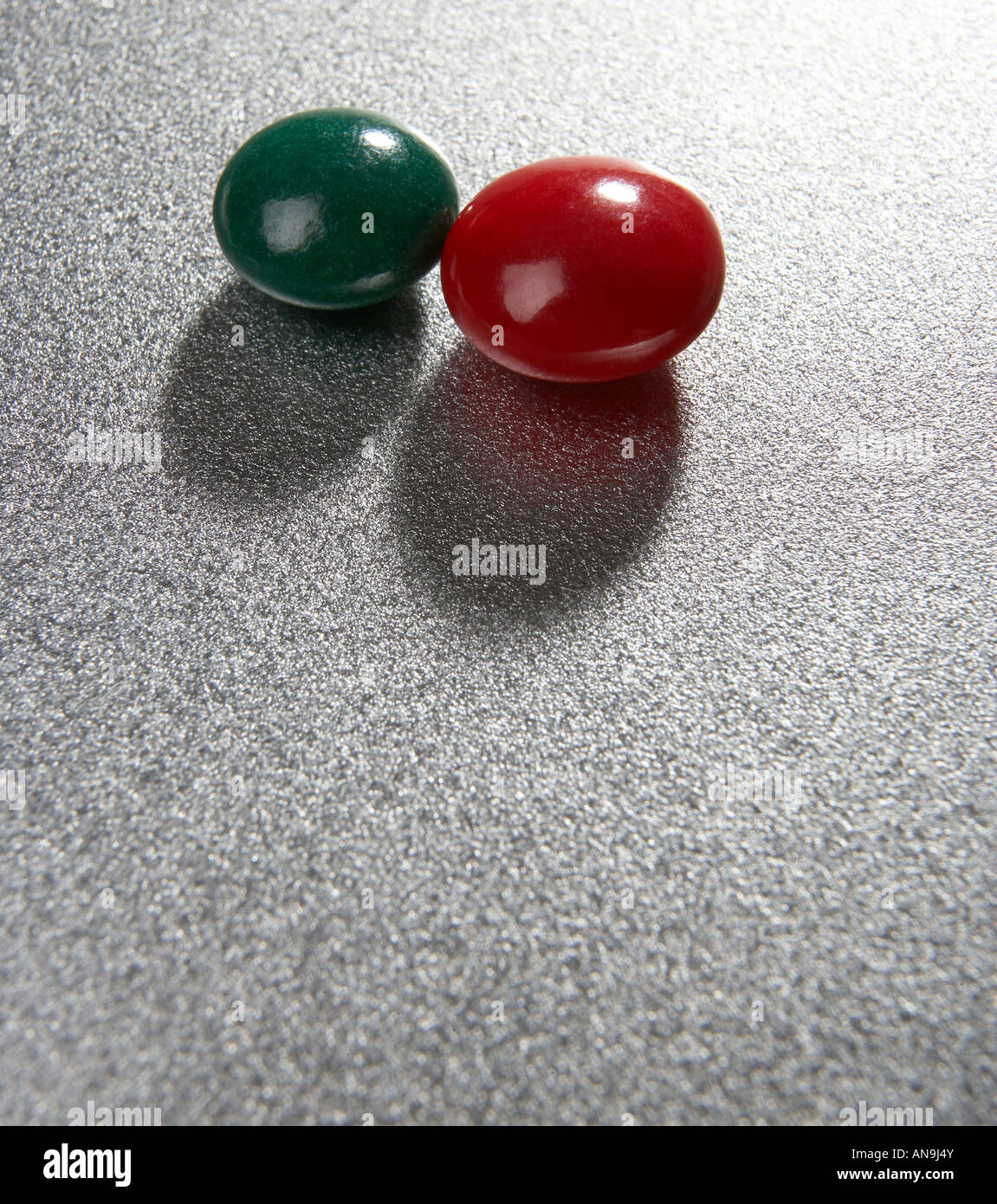 Red and Green coated pills Stock Photo - Alamy